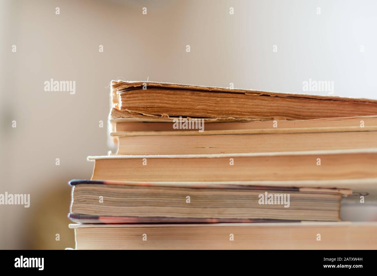 Side view of 6 battered textbooks. Free space for text. Close-up ...