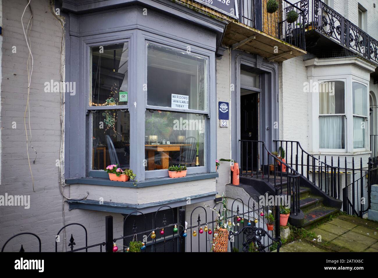 A guesthouse in Margate with no rooms available today sign in window ...