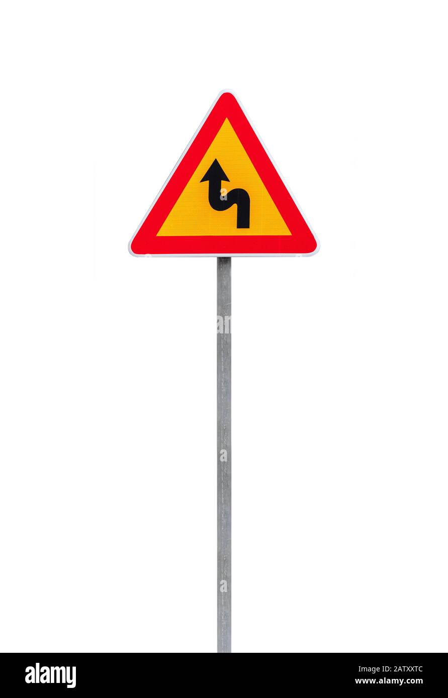 Dangerous turns, red triangle warning traffic sign on a metal pole ...