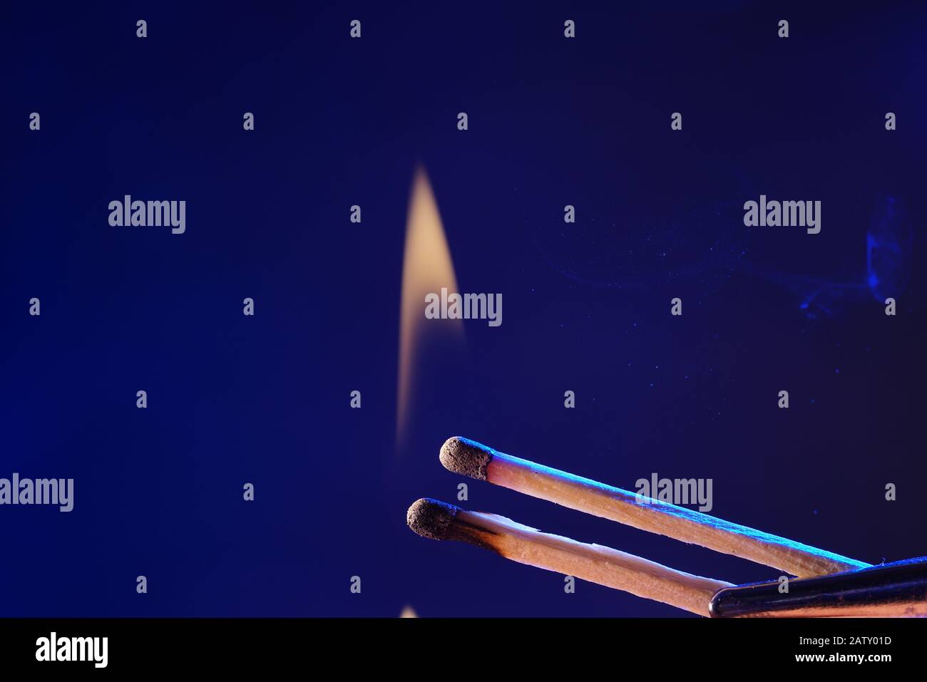 Lit matches and blown out in the studio photographed with colorful ...