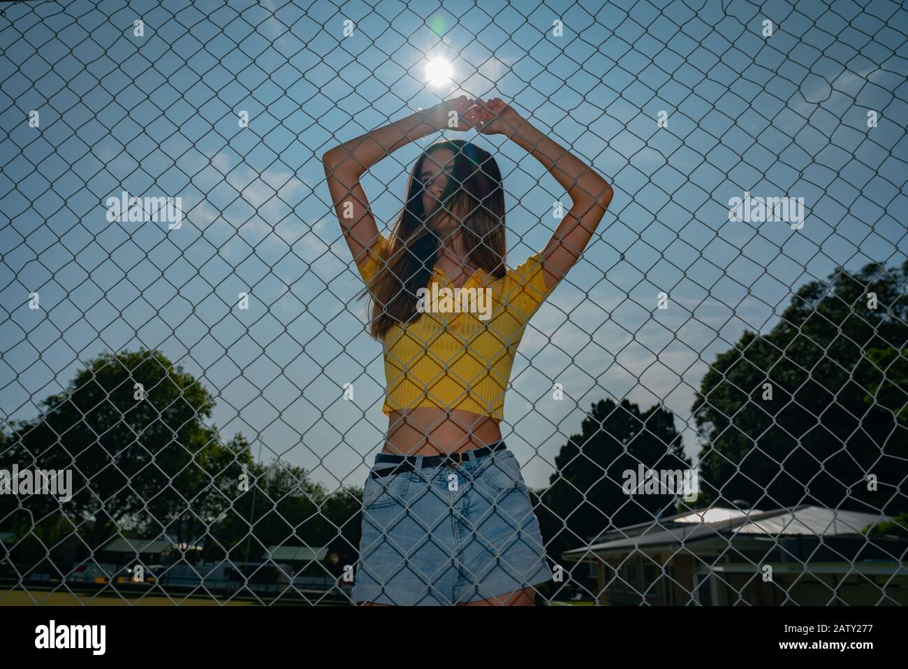 Girl chain link fence hi-res stock photography and images - Alamy