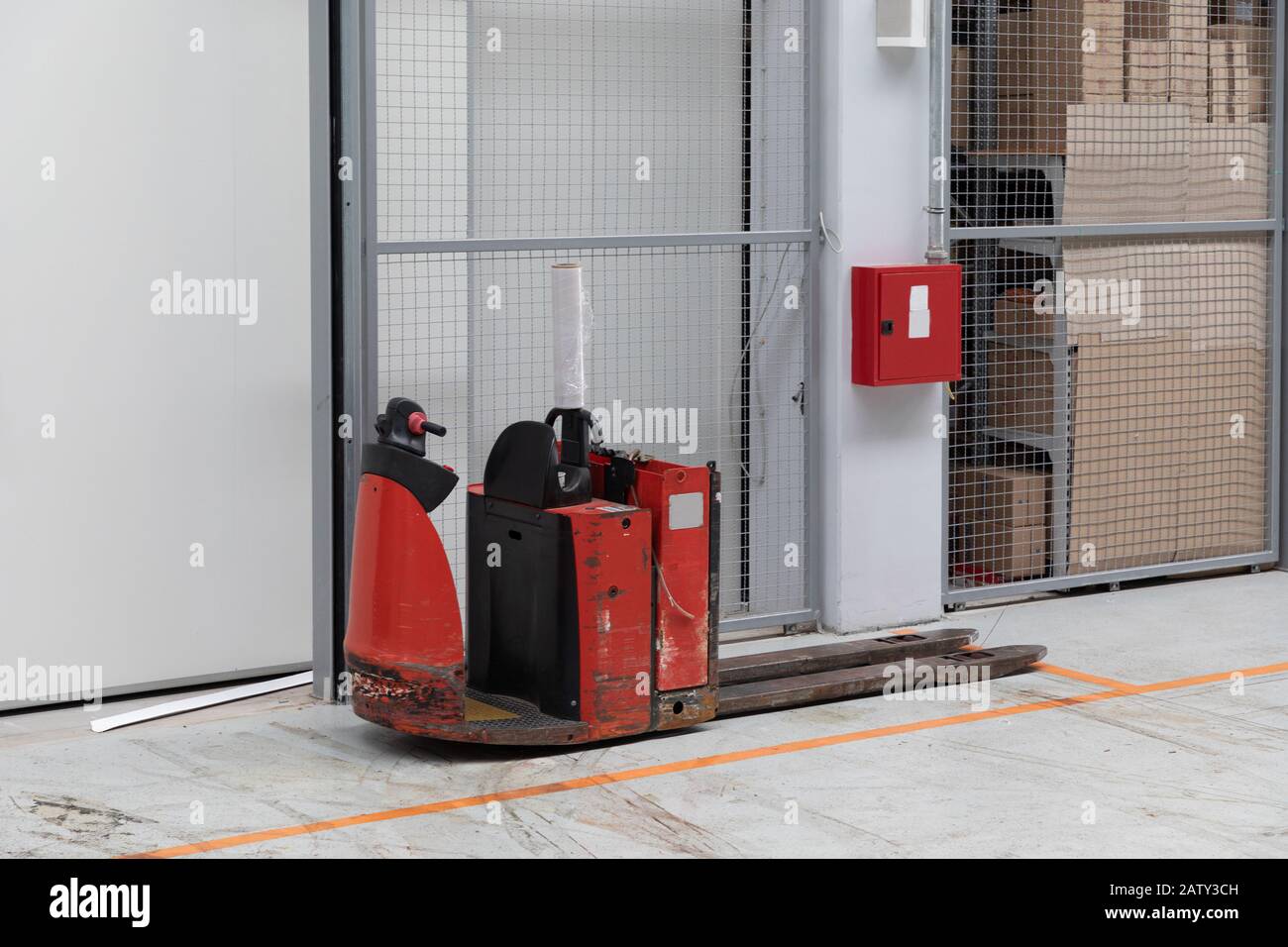 Pallet Truck With Long Forks in Warehouse Stock Photo - Alamy