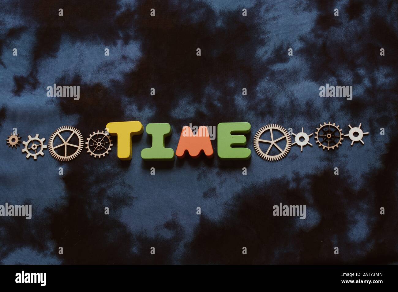 Hand pointing to time wording with gears Stock Photo - Alamy