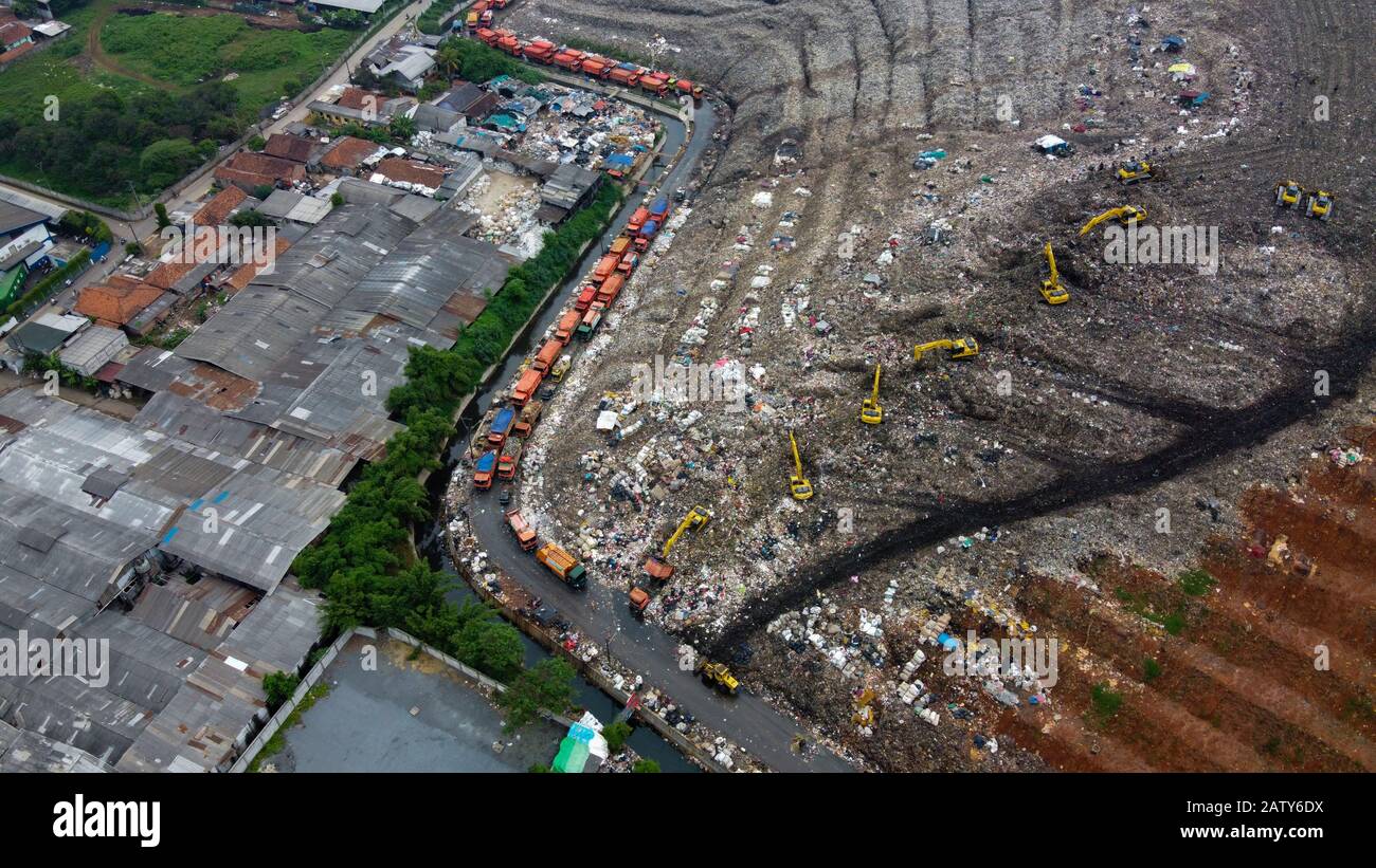 Aerial View. Large landfills like mountains. the tractor take garbage ...