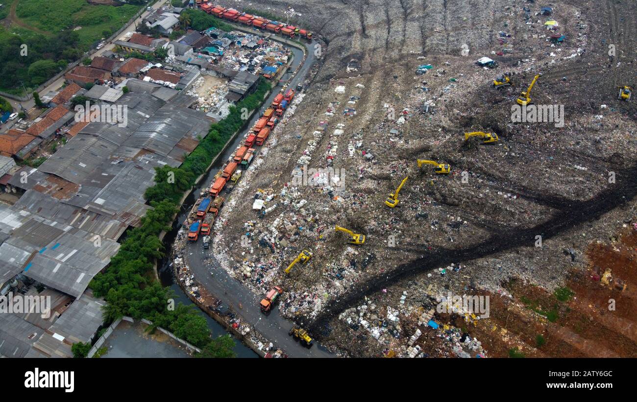Aerial View. Large landfills like mountains. the tractor take garbage ...