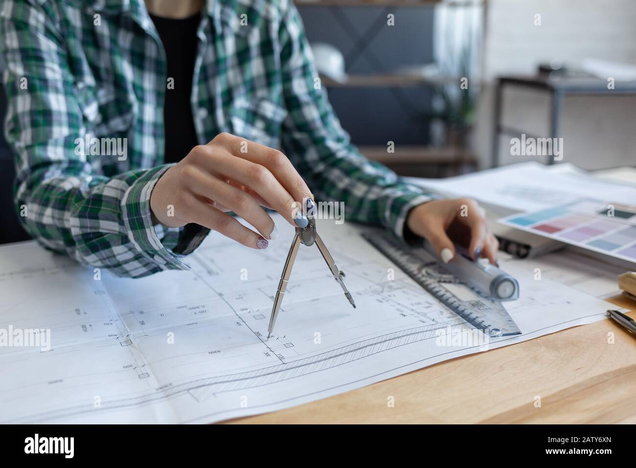 Architect drawing blueprints in office. Engineer sketching a ...