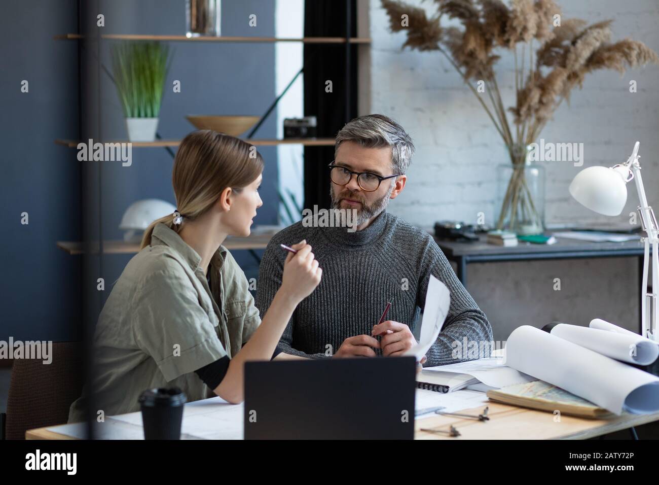 Engineer team working in office with blueprints and architect equipment ...