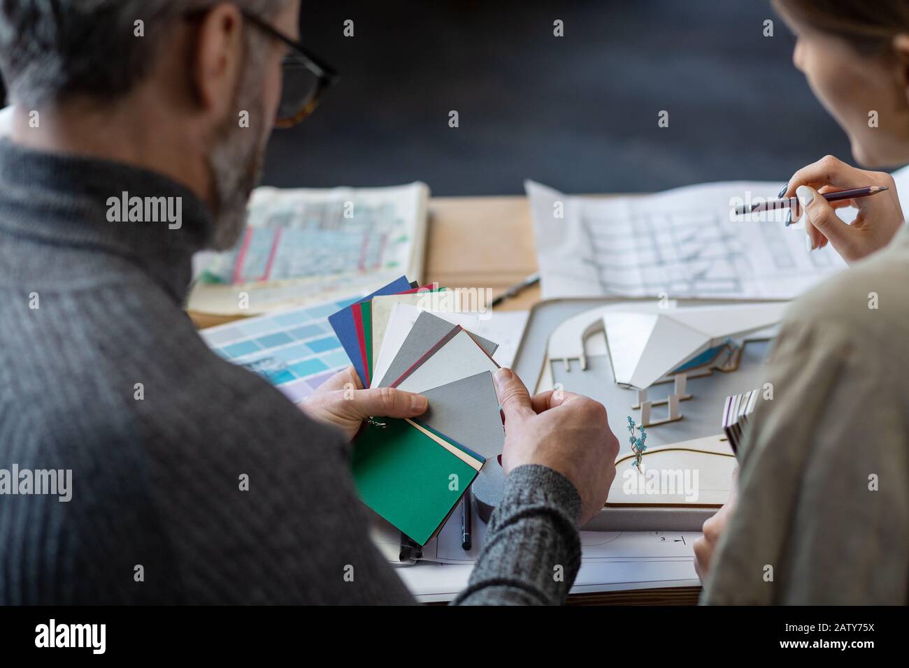 Interior designers team working in office with color palette ...