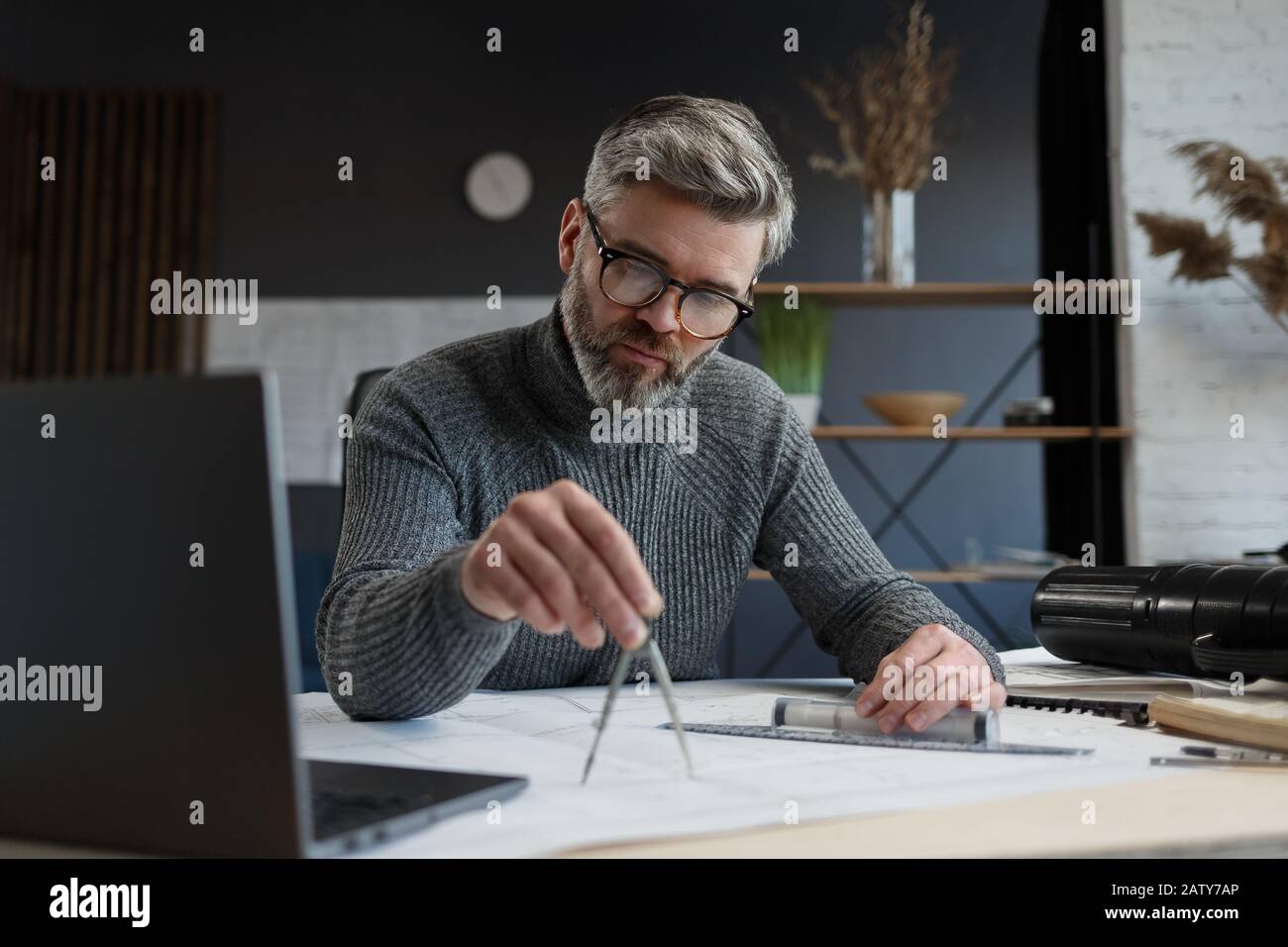 Interior designer working in office with blueprints.Engineer inspect ...