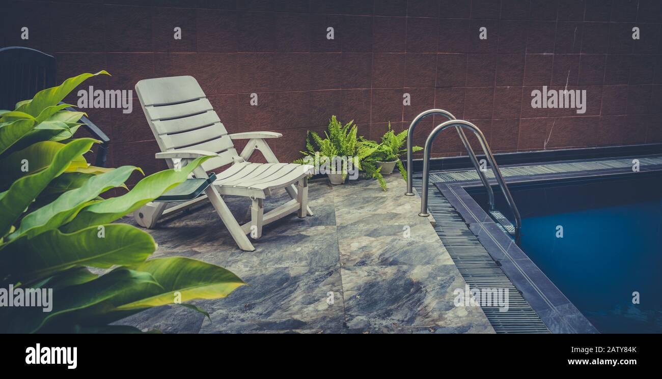 pool deck with white chair in Kandy view hotel Stock Photo - Alamy