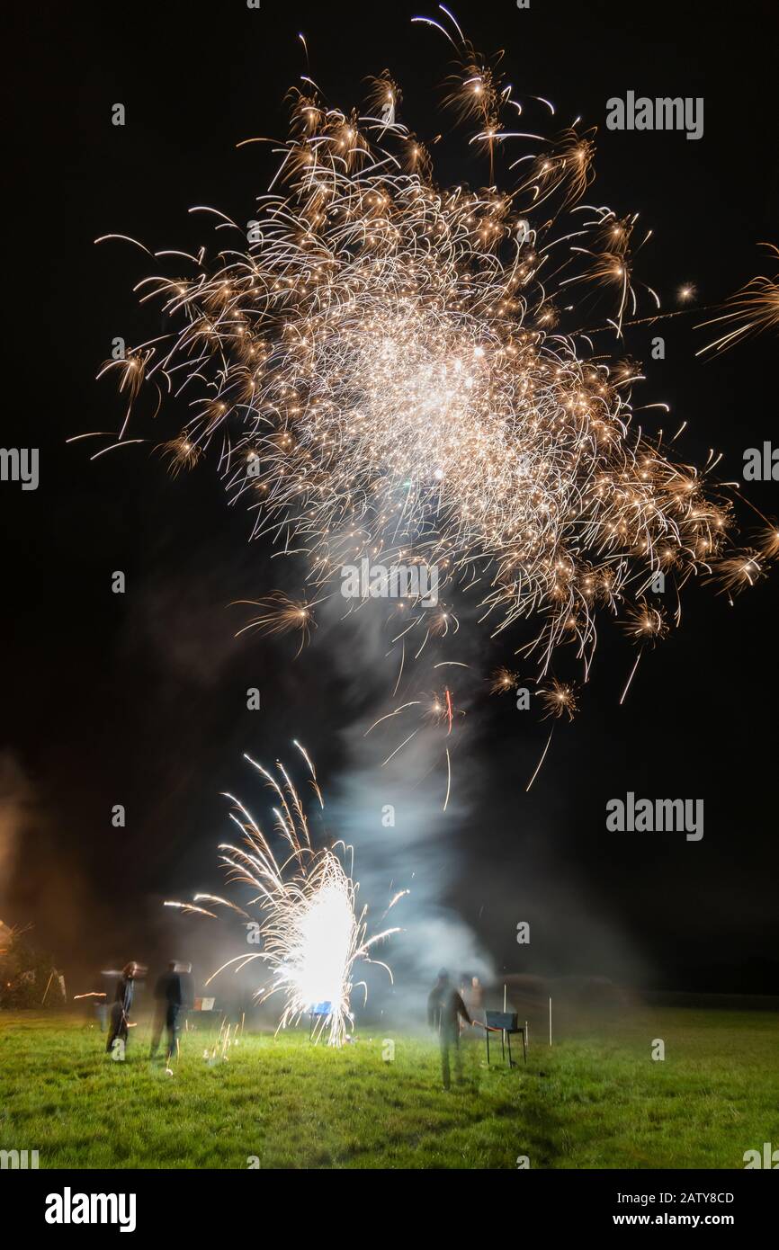 Long exosure of people letting off fireworks Stock Photo - Alamy