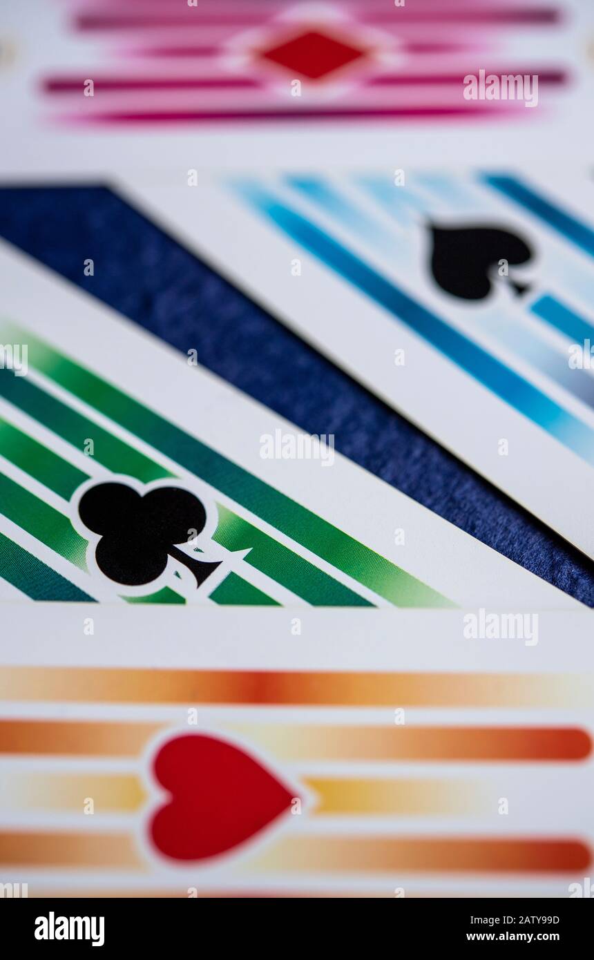 Reverse side of four playing cards showing the four suits Stock Photo ...