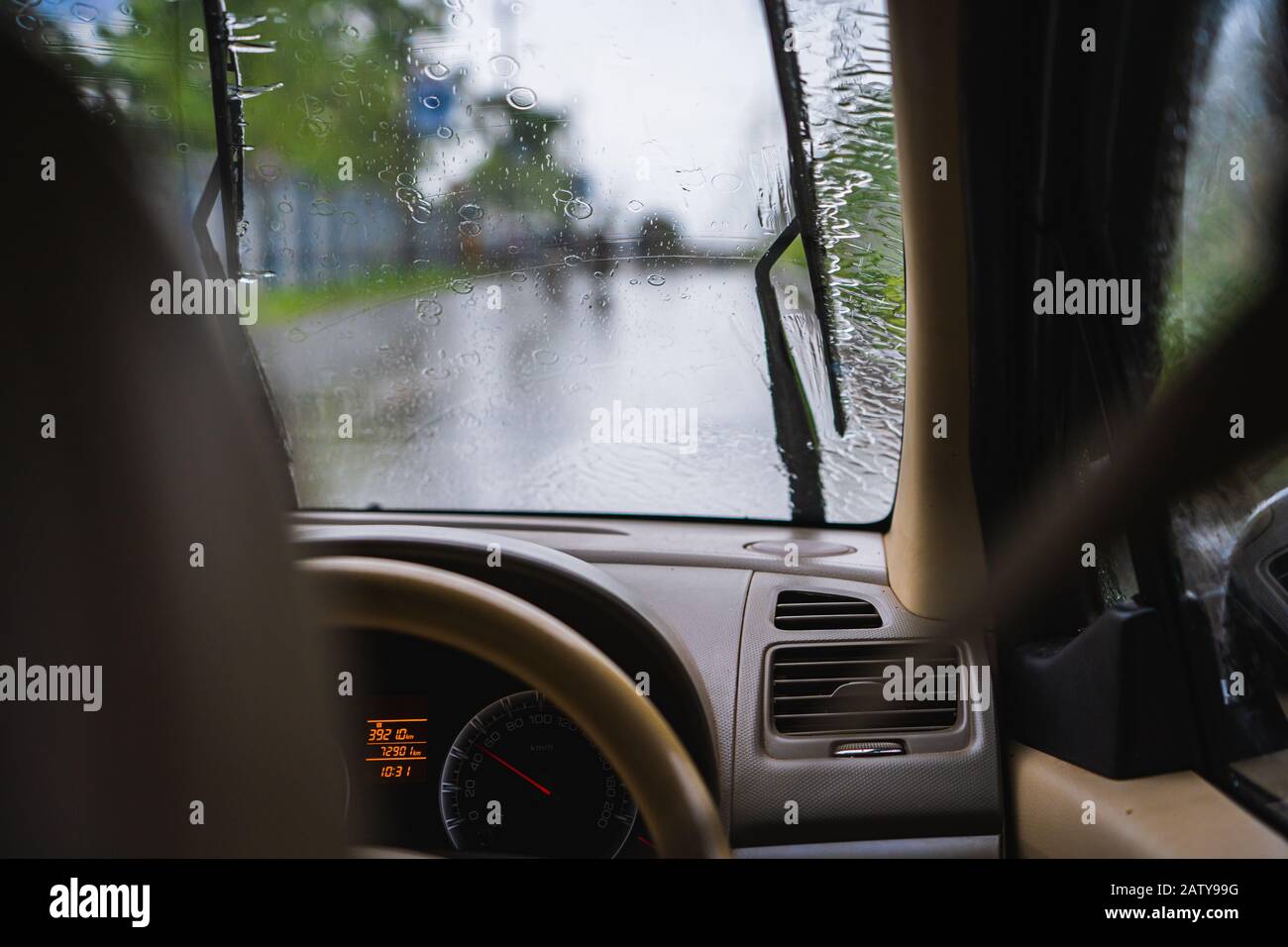 Dashboard view of a car during rain Stock Photo - Alamy