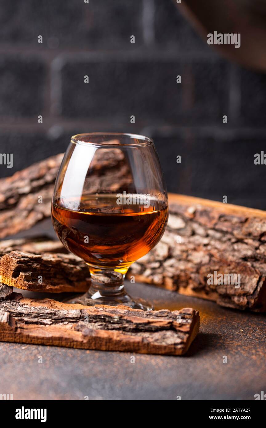 Glass of cognac or whiskey Stock Photo - Alamy