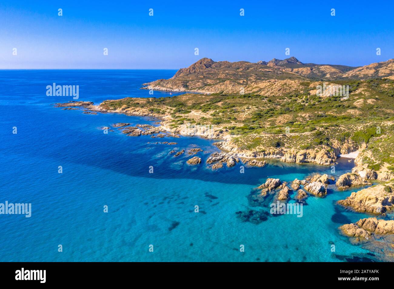 Aerial view of Corsican rocky coast with blue water of Mediterranean ...