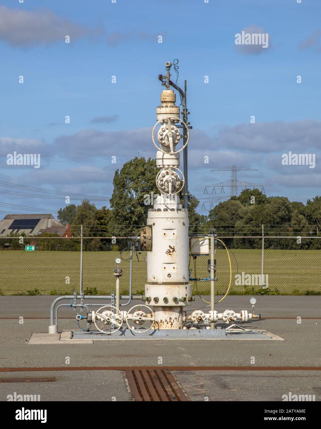 Natural gas wellhead on LNG production station site in Groningen ...