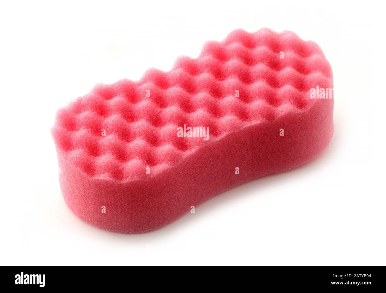 Red sponge for washing dishes on a white background. The sponge has a ...