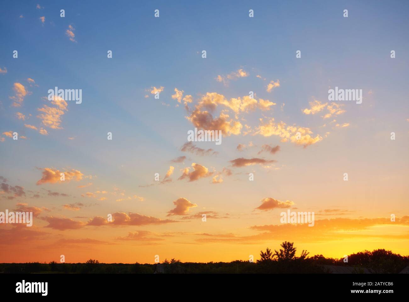 Sunset sunrise with clouds, light rays and other atmospheric effect ...