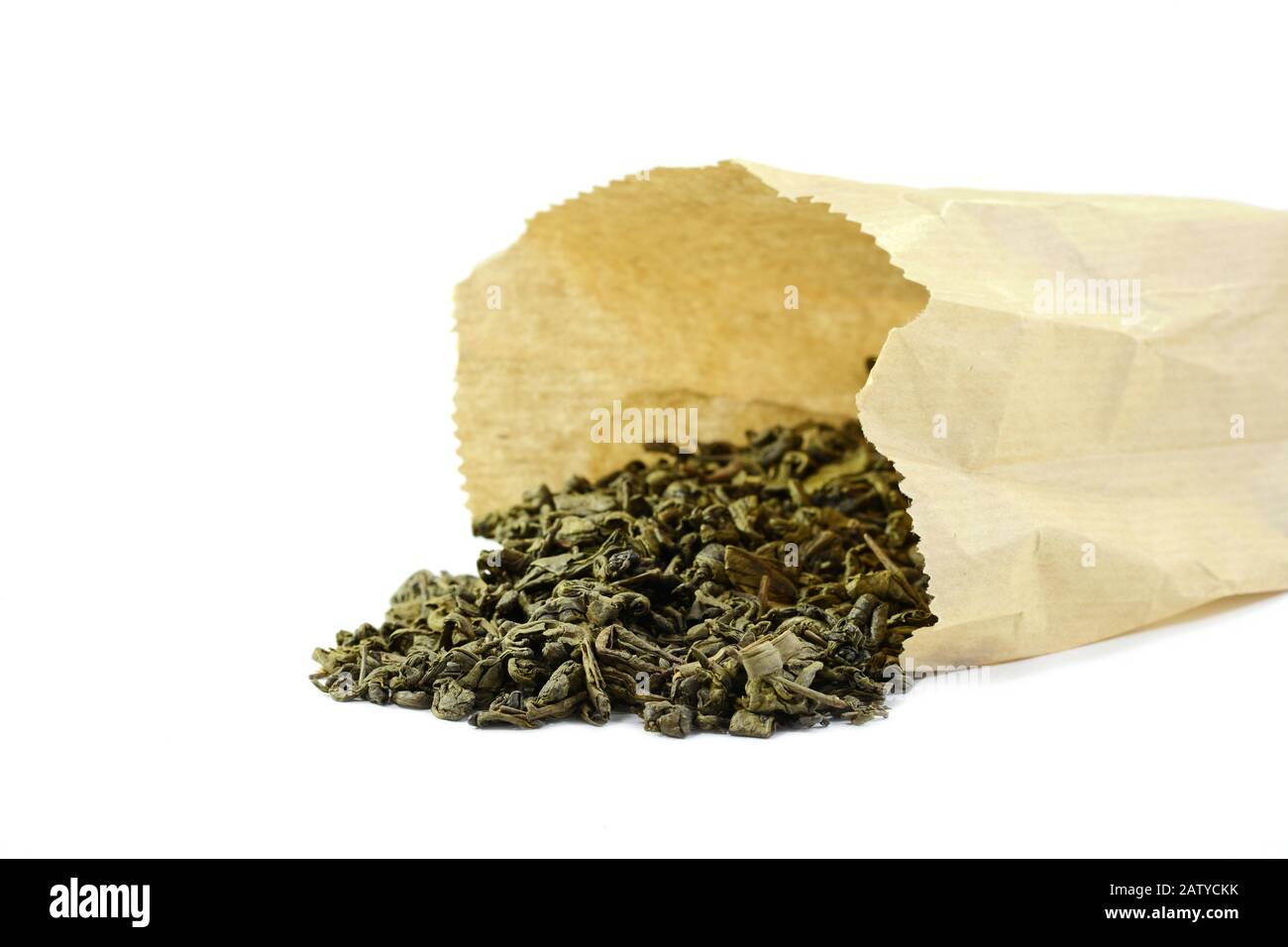 Dry green tea in a paper bag isolated on white background Stock Photo ...