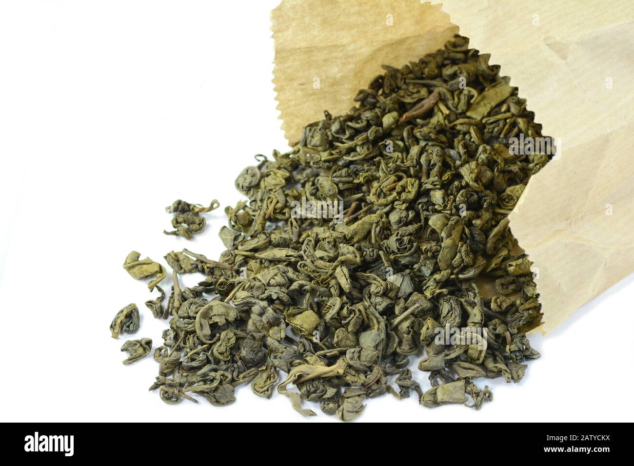 Dry green tea in a paper bag isolated on white background Stock Photo ...