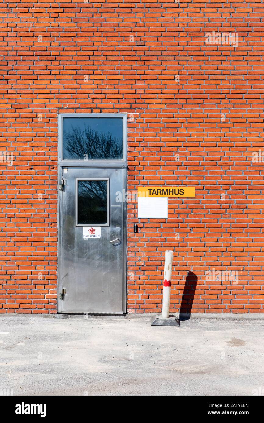 Danish Crown Slaughterhouse, "Tarmhus", sign by door in red brick wall ...