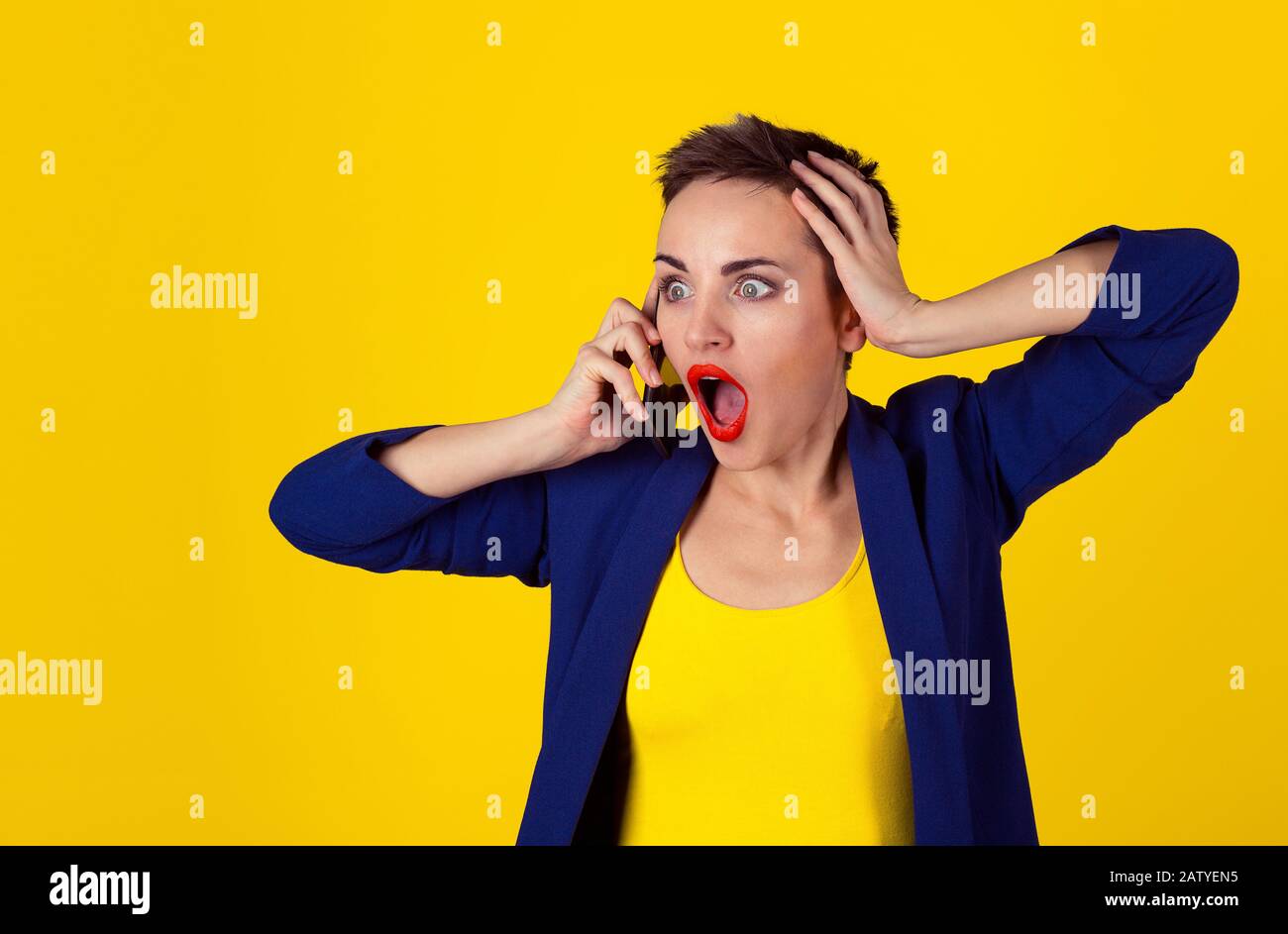 Shocked at phone Half length body woman short hair girl boy alike trans ...