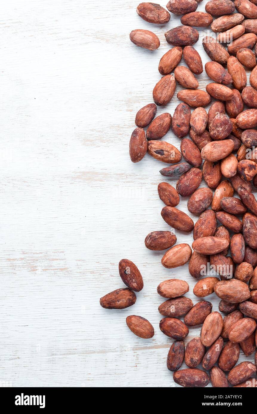 Cocoa beans on a white background. Top view. Free copy space Stock ...