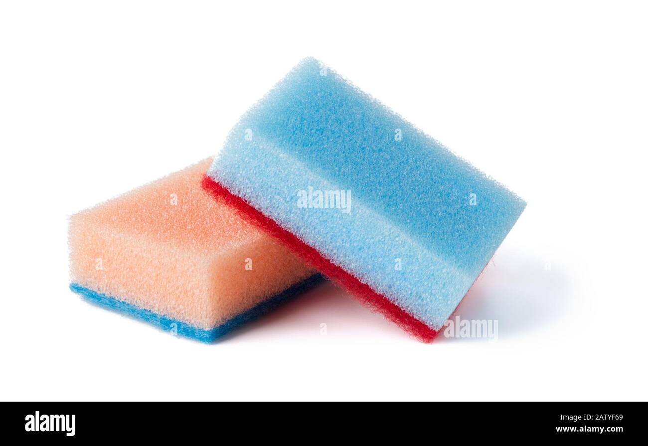 Two kitchen foam sponges of pastel orange and blue colors isolated on ...
