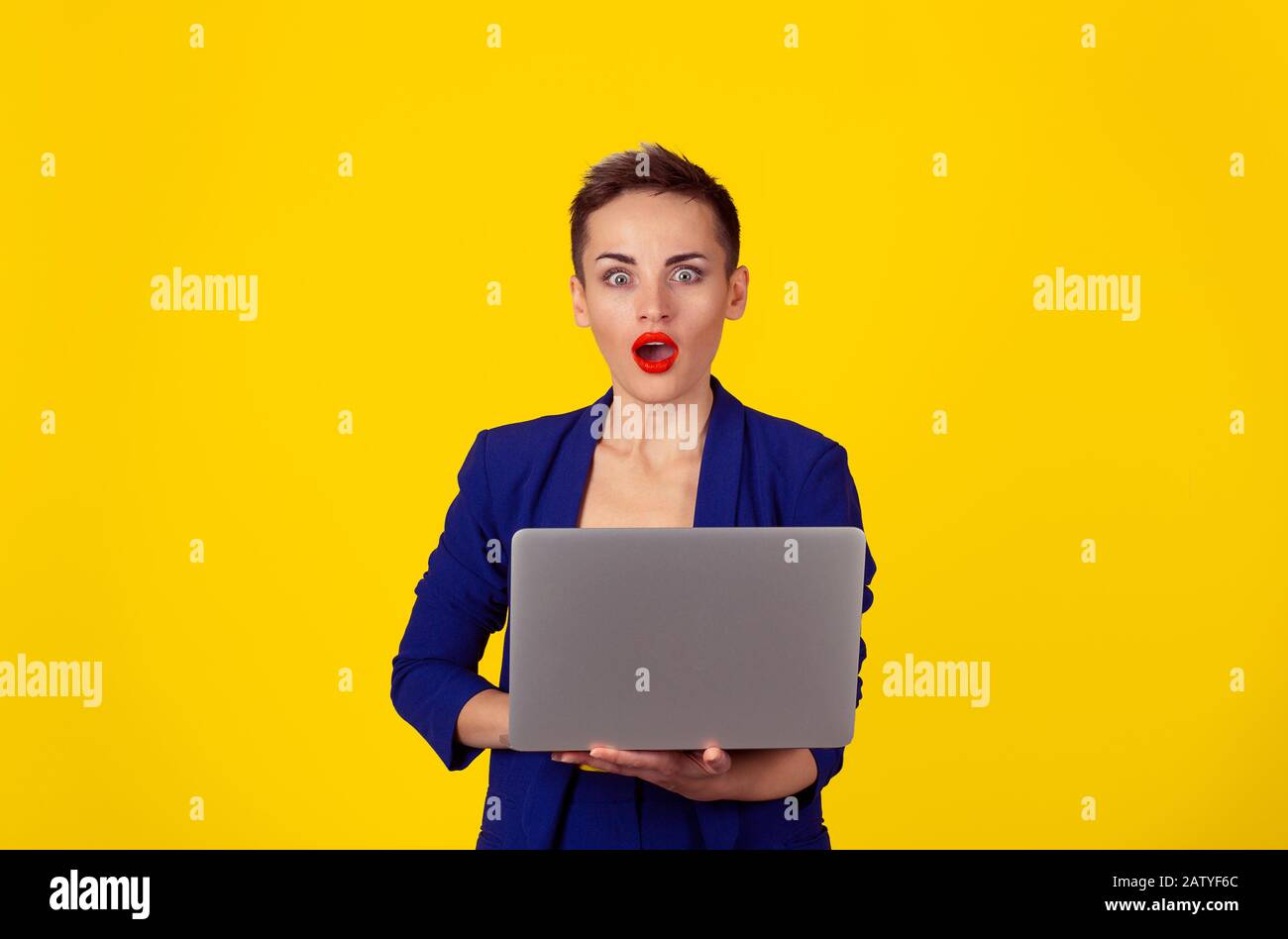 Stressed shocked businesswoman in front computer laptop in her office ...