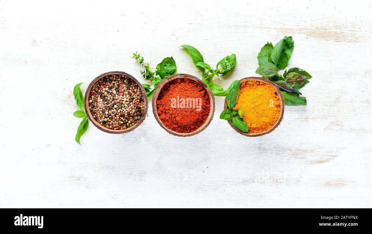 Various spices in a bowls on white background. Indian spices. Top view ...