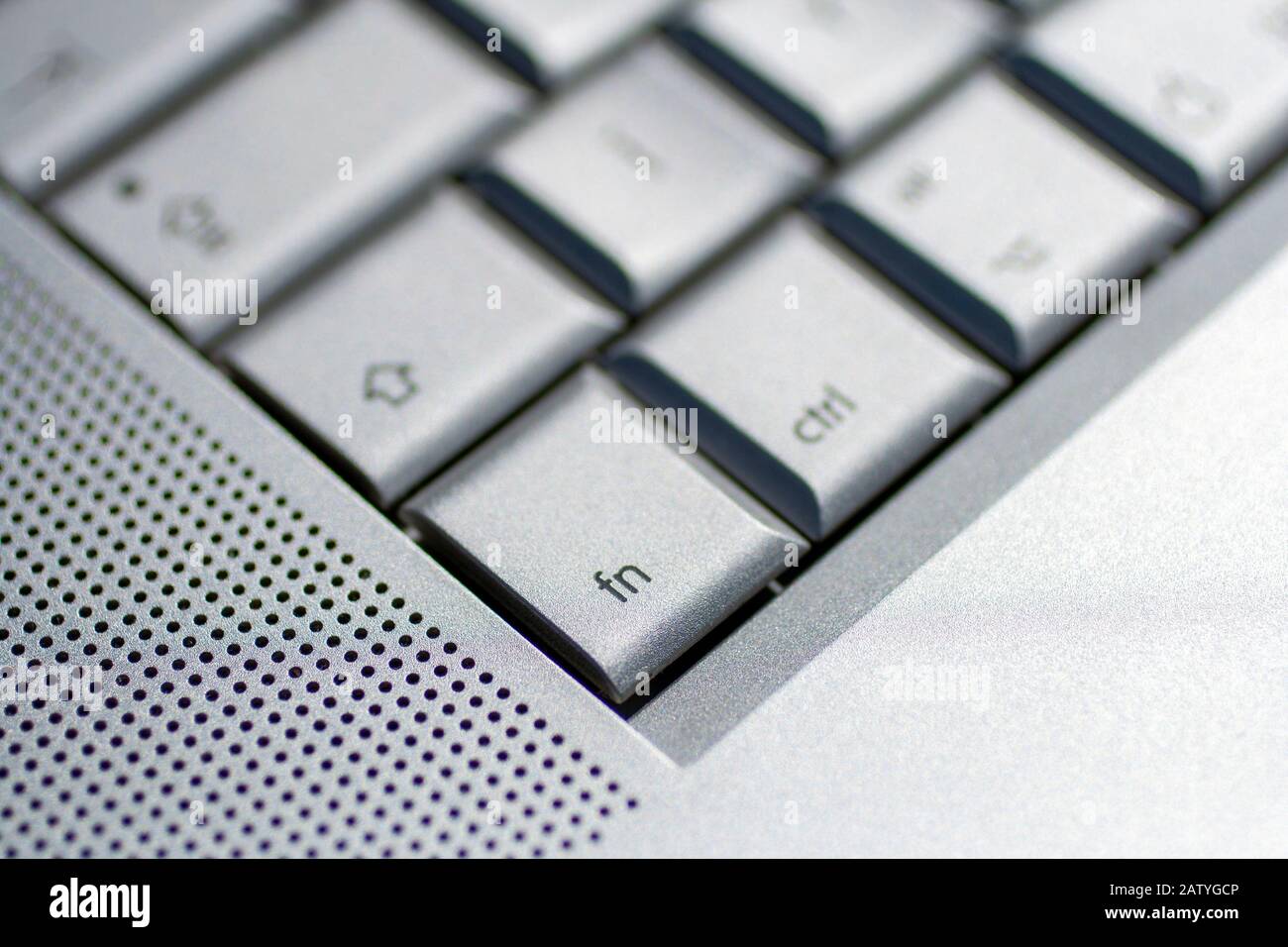 Silver keyboard on an old laptop Stock Photo - Alamy