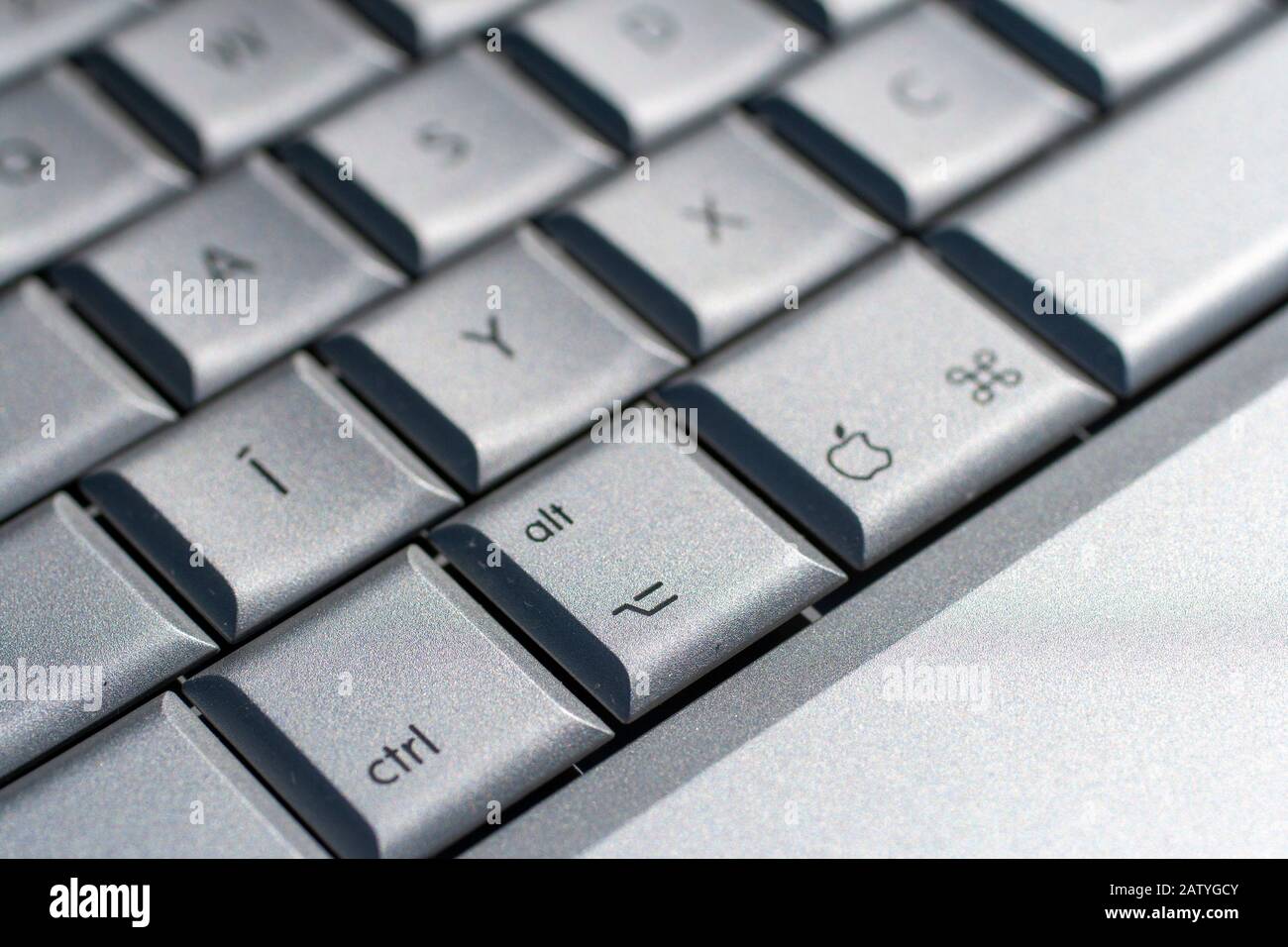Silver keyboard on an old laptop Stock Photo - Alamy