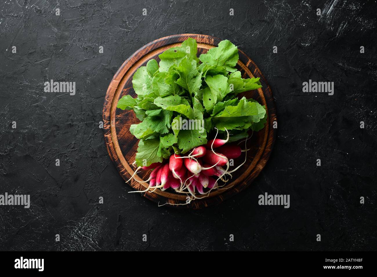 Fresh radish on a black stone background. Red radish Top view Stock ...