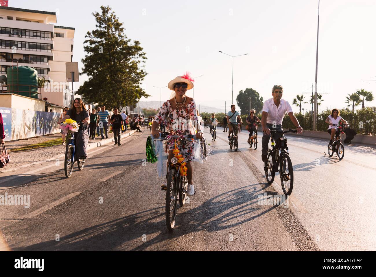 Izmir, Turkey - September 23, 2018: People riding bicycles with baloons ...