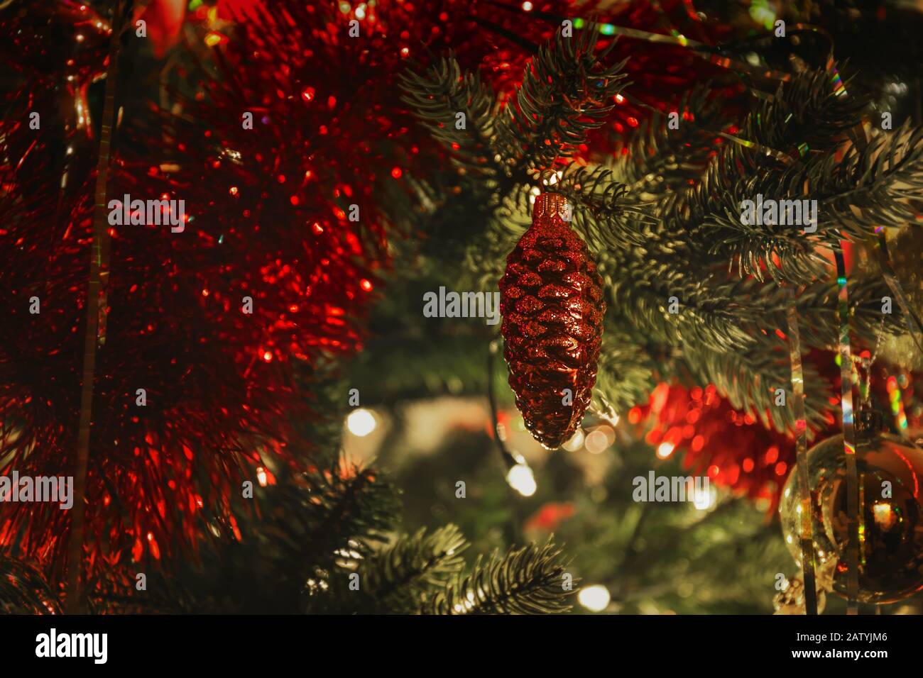 One christmas bump on a christmas tree in the light of electric garland ...