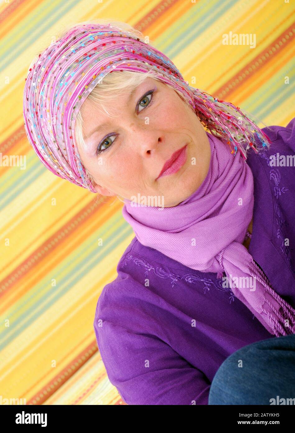 Portrait of blonde gypsy woman looking at camera Stock Photo - Alamy