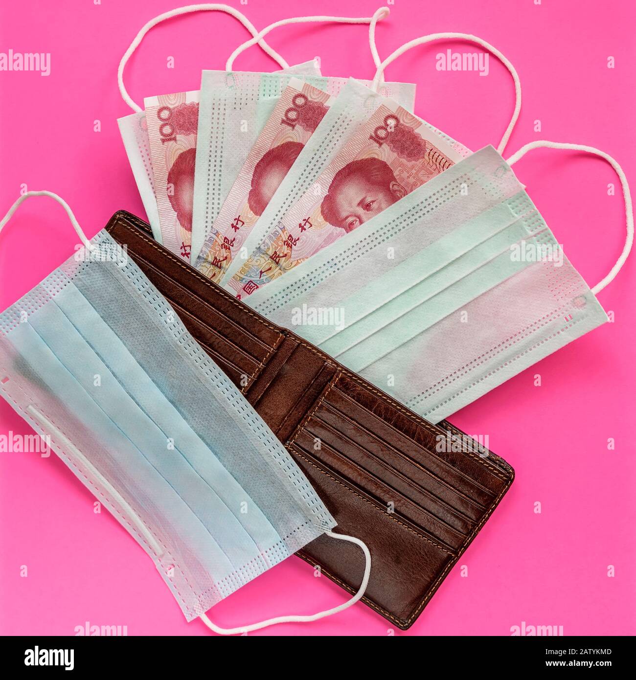 Wallet, disposable protective masks and cash chinese money on pink ...