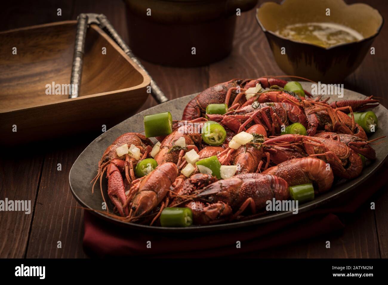 A close up of a platter of steamed crawfish and bits of peppers Stock ...