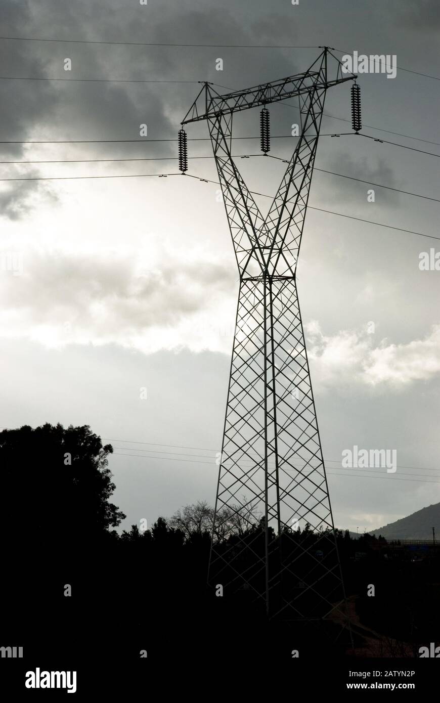 Electric Pylon, in the background dark clouds Stock Photo - Alamy