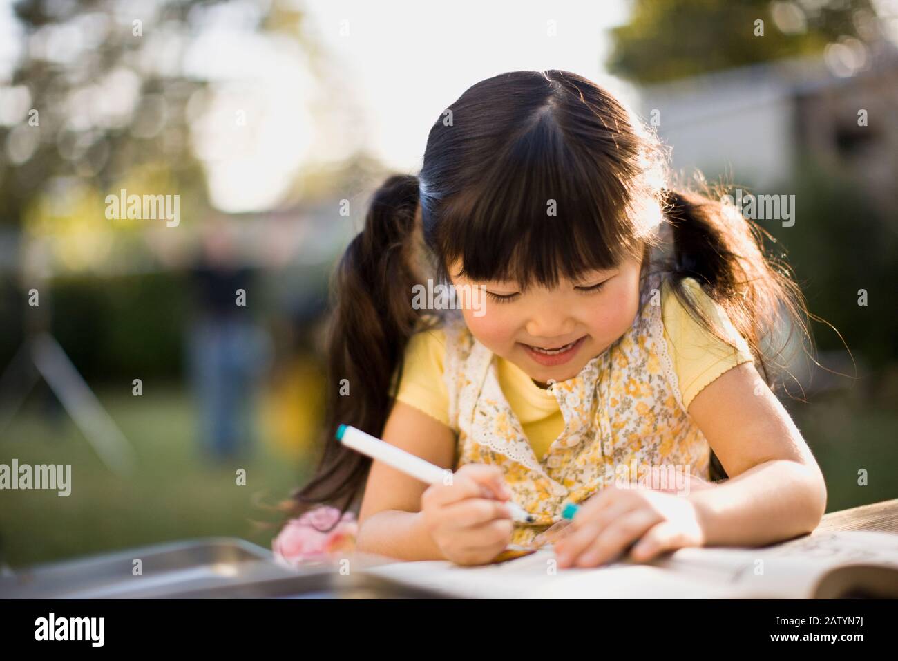 Young girl coloring Stock Photo - Alamy