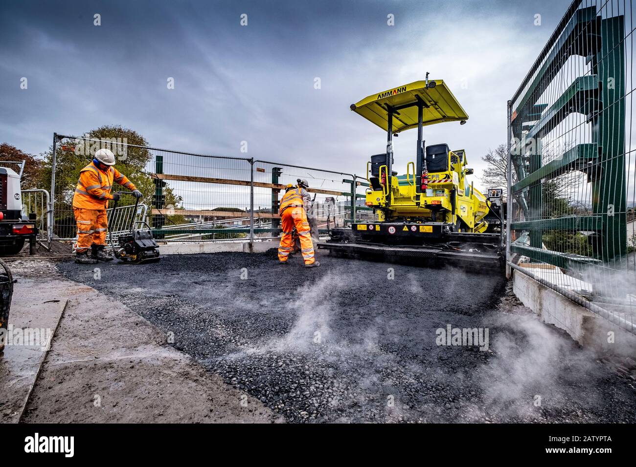 Laying a new road over a rail bridge Stock Photo - Alamy