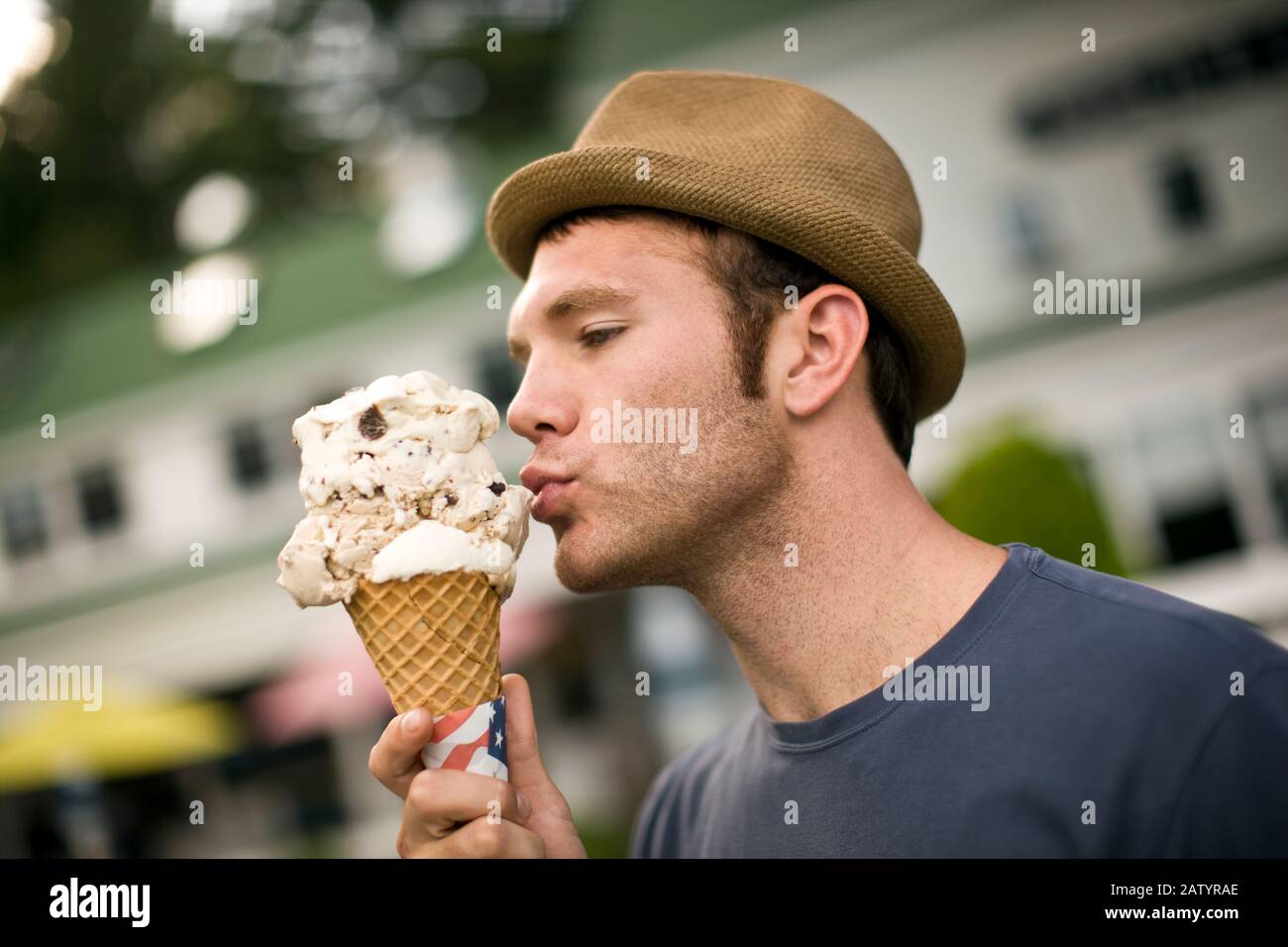 Man eating enormous ice cream cone Stock Photo - Alamy