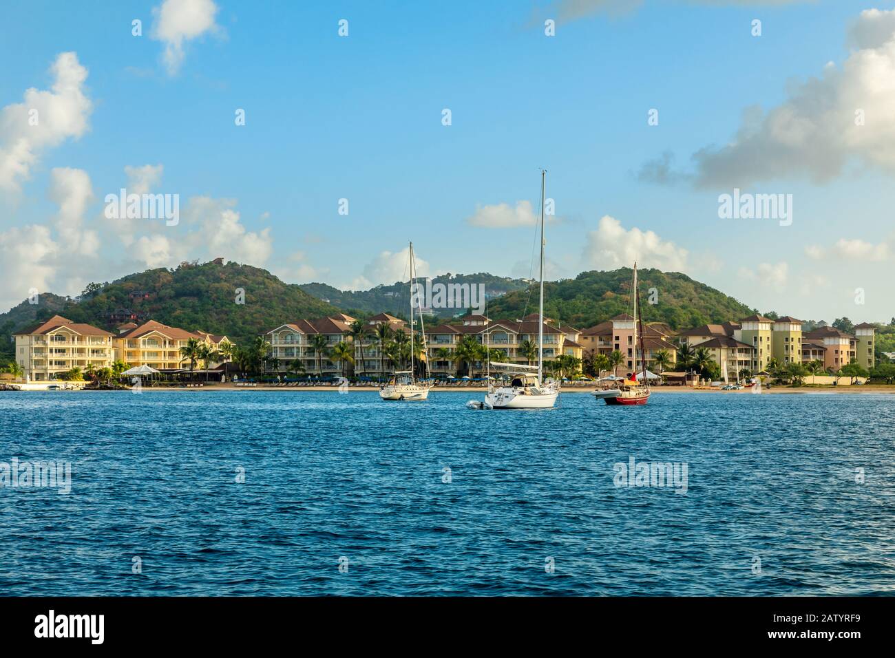 Offshore view of Rodney bay with yachts anchored in the lagoon and rich ...