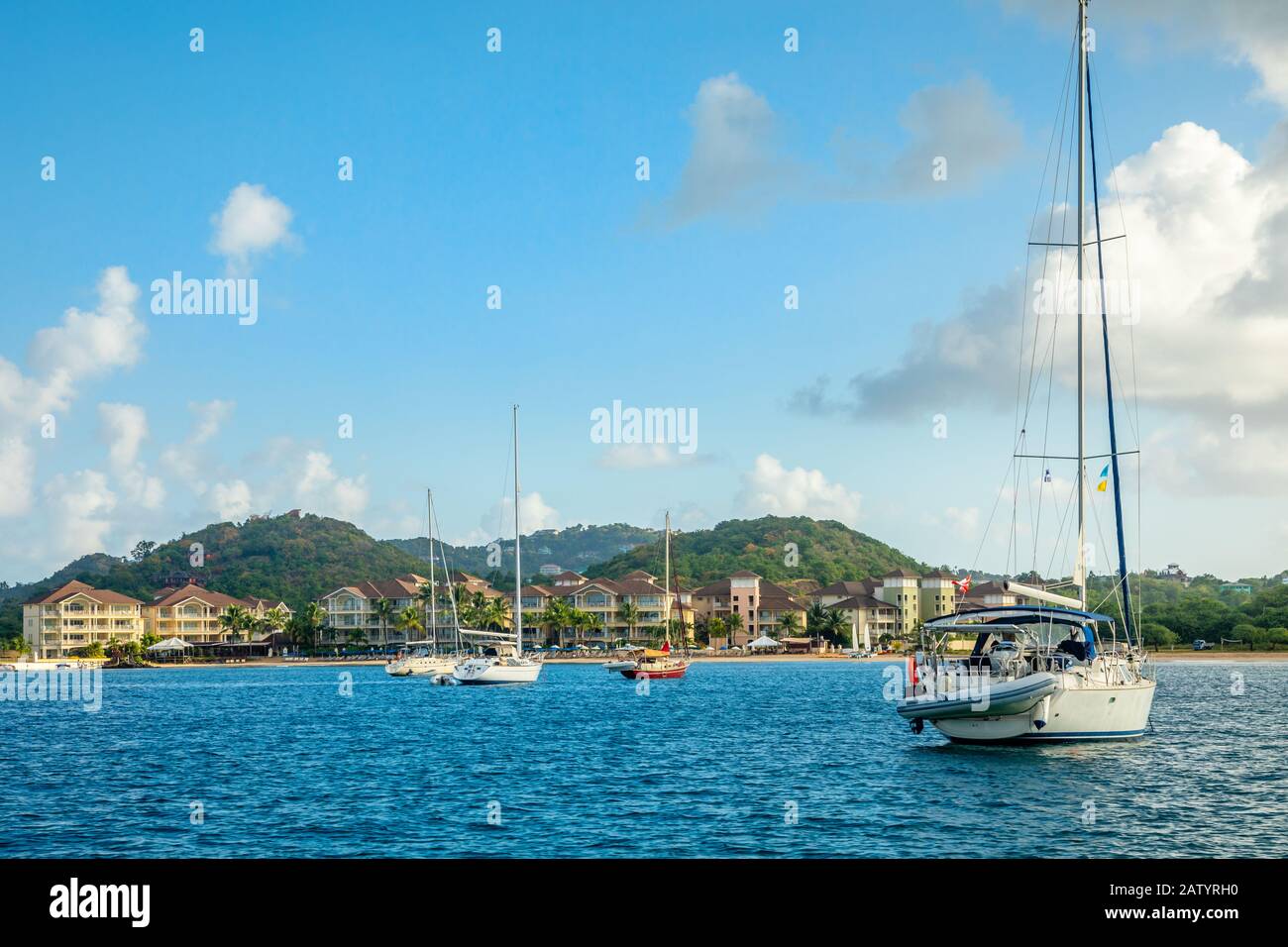 Offshore view of Rodney bay with yachts anchored in the lagoon and rich ...