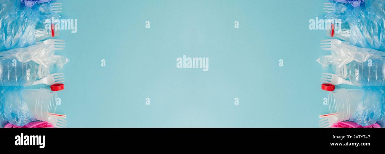 Top view of various kinds of disposable plastic waste on blue ...