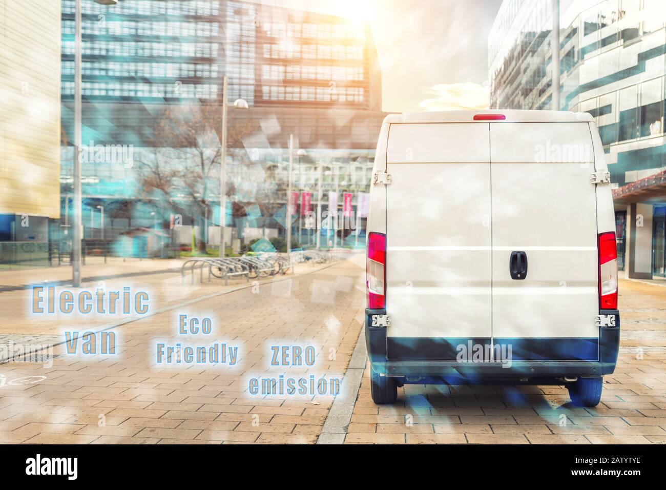 Small cargo electric delivery van driving in european city central ...