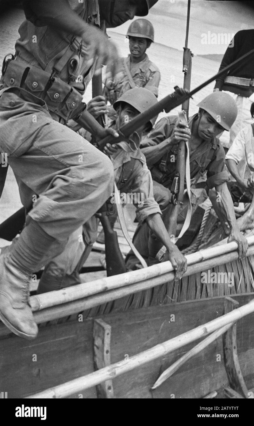 Borneo Soldiers wade through the sea to the beach Date: February 1947 ...