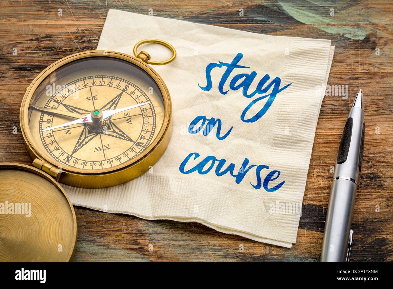 Stay on course reminder - motivational handwriting on a napkin with an ...
