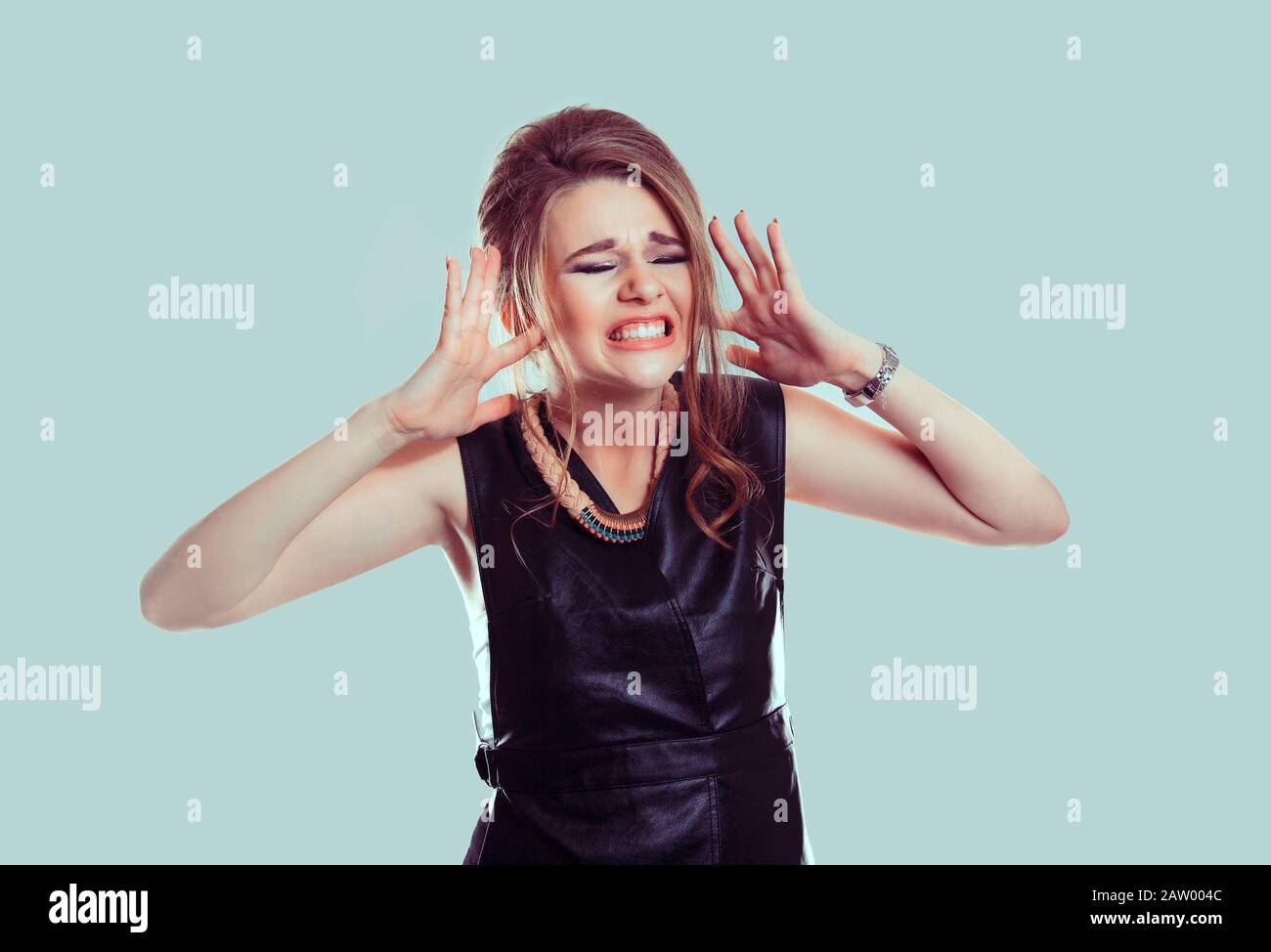 Too loud. Closeup portrait stressed woman covers ears with hands ...