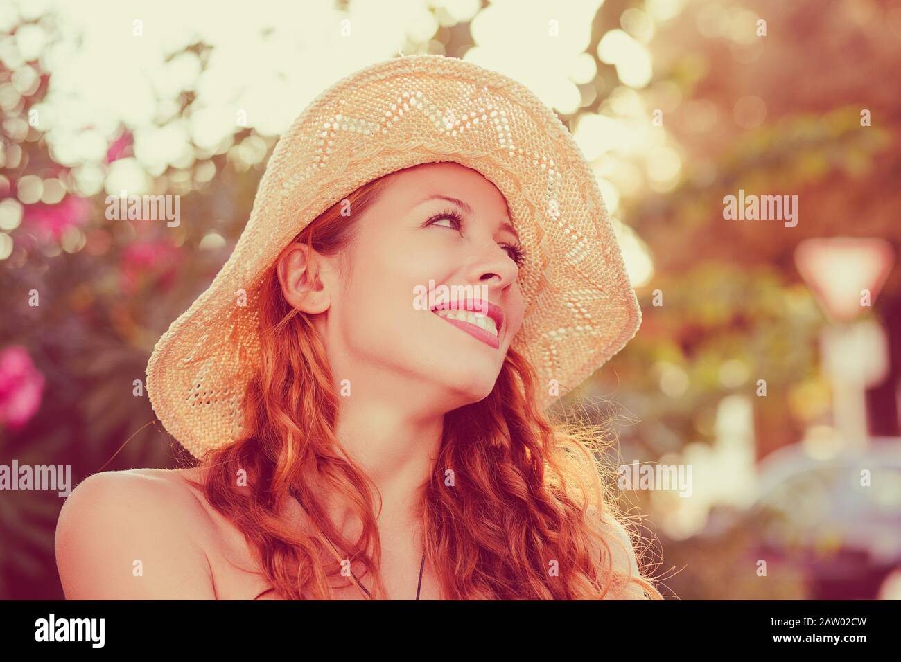 Happy girl. Woman in hat looking side wards smiling happy isolated ...